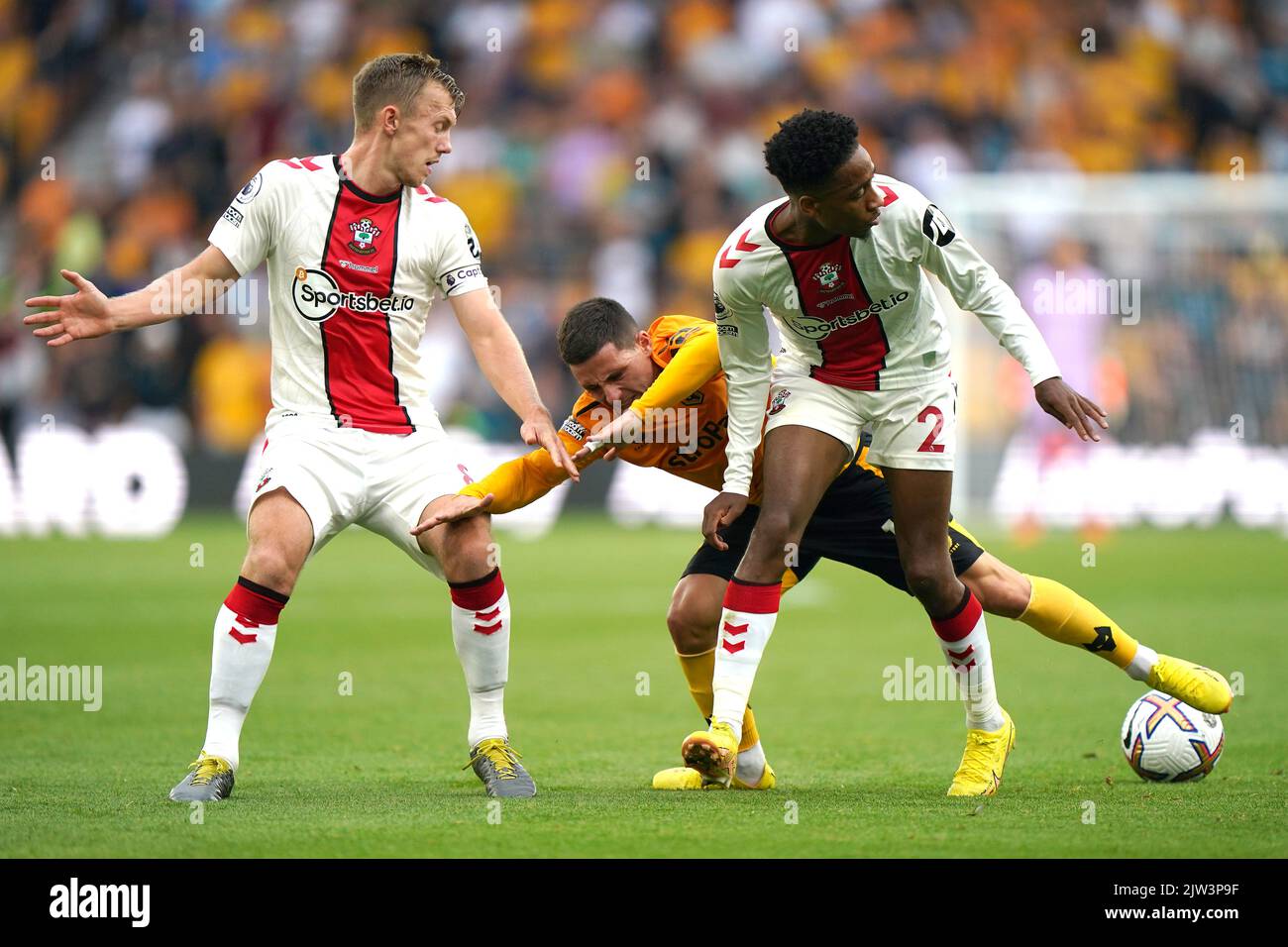 Wolverhampton Wanderers' Daniel Podence (centre) battles of the ball ...