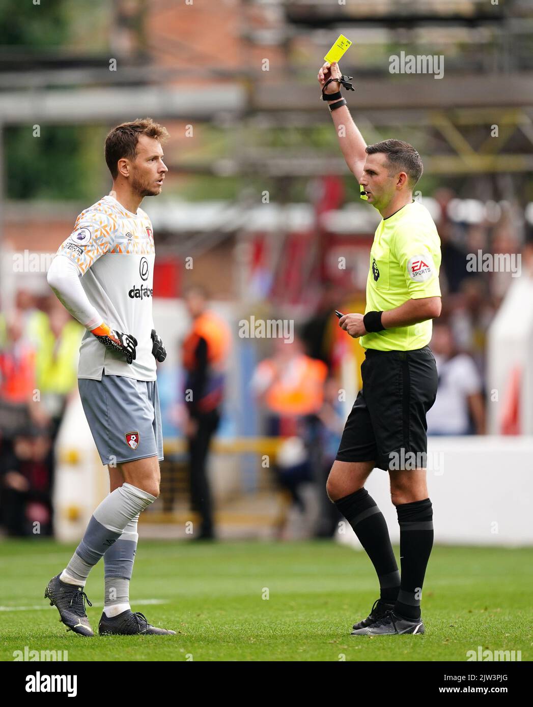 Referee Michael Oliver shows AFC Bournemouth goalkeeper Murara Neto a ... Referee Michael Oliver shows AFC Bournemouth goalkeeper Murara Neto a ...