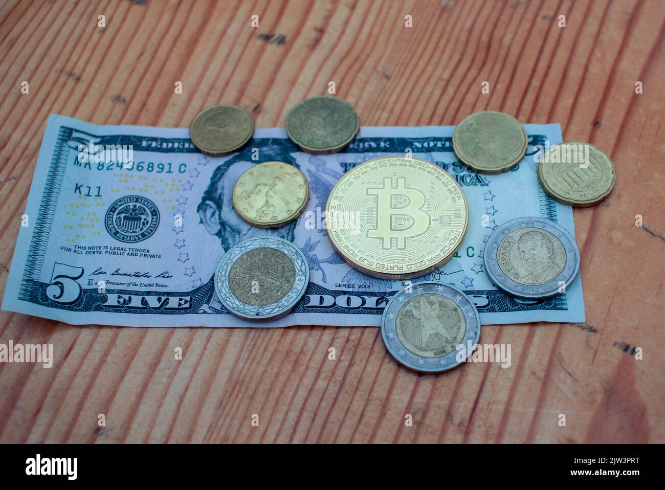 bitcoin shines with its own light between other currencies Stock Photo ...