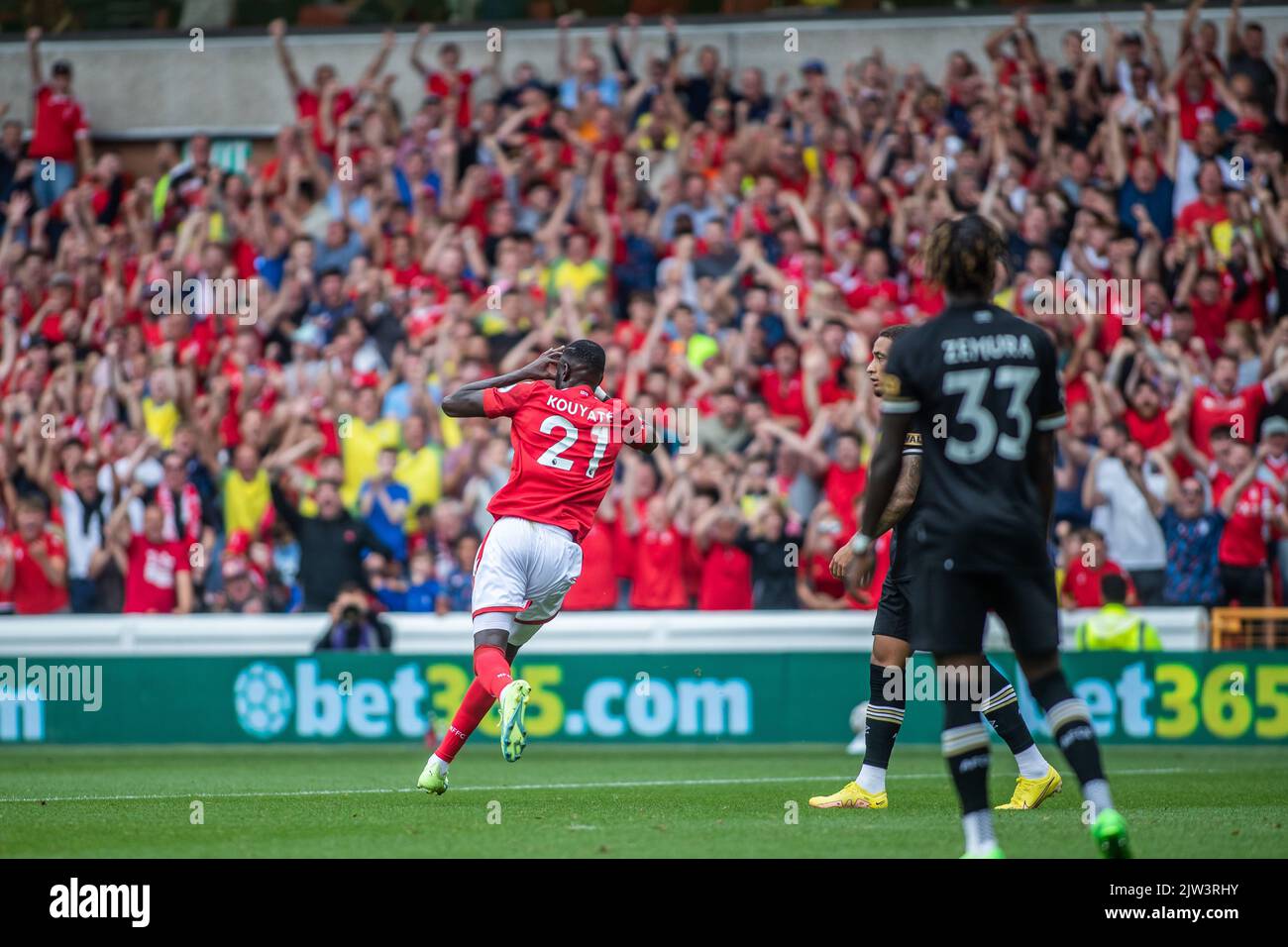 Cheikhou Kouyaté #21 of Nottingham Forest sets off in celebration after ...