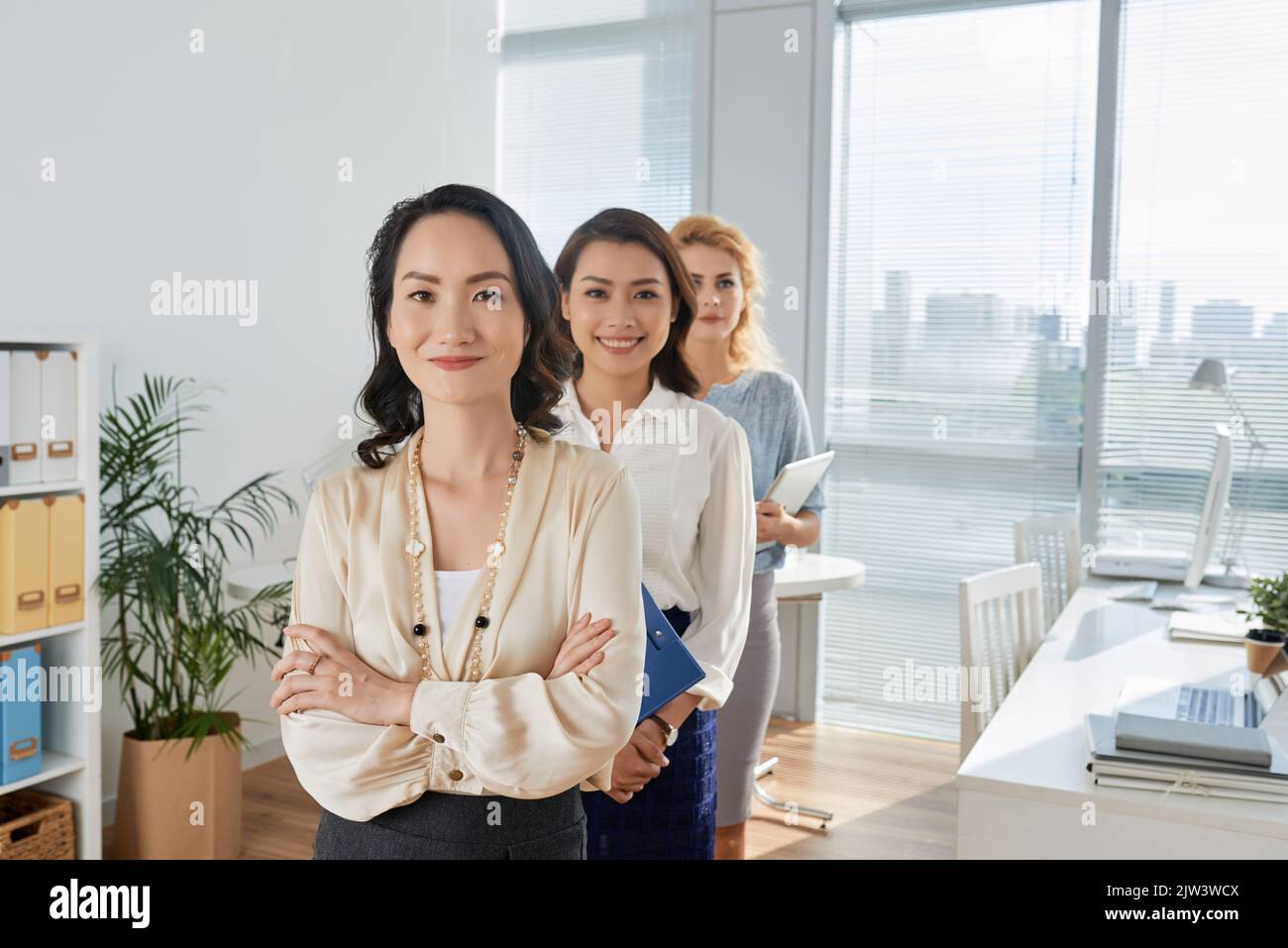 Coworker standing hi-res stock photography and images - Alamy
