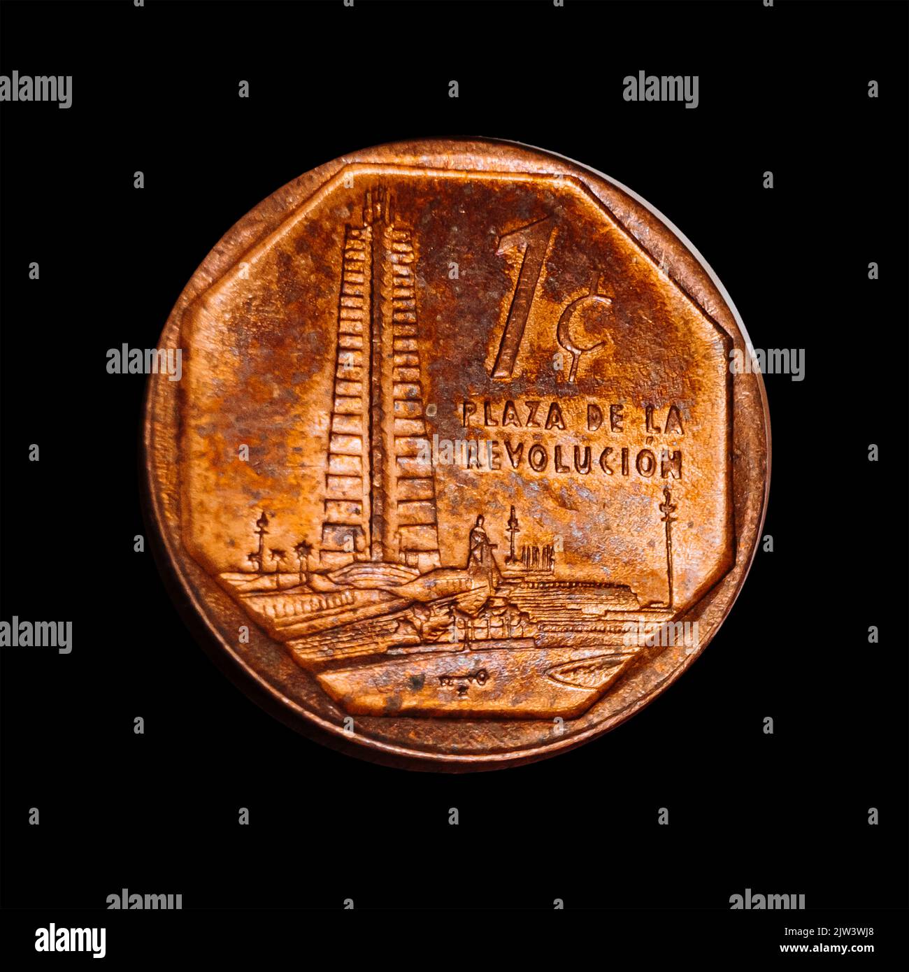 An old coin isolated on a black background Stock Photo - Alamy