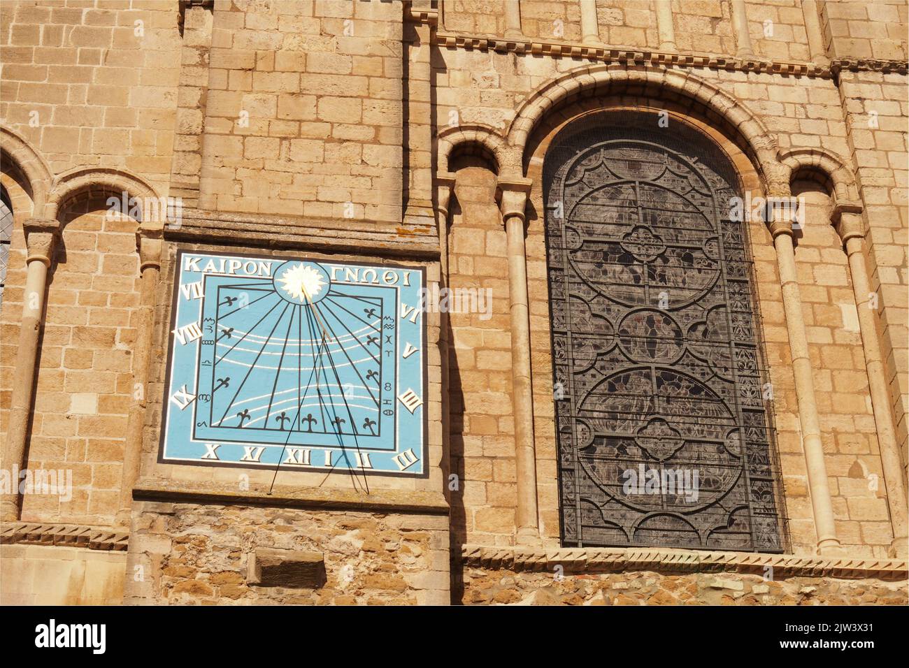 A view of the sundial on A view of some of the windows of Ely cathedral ...