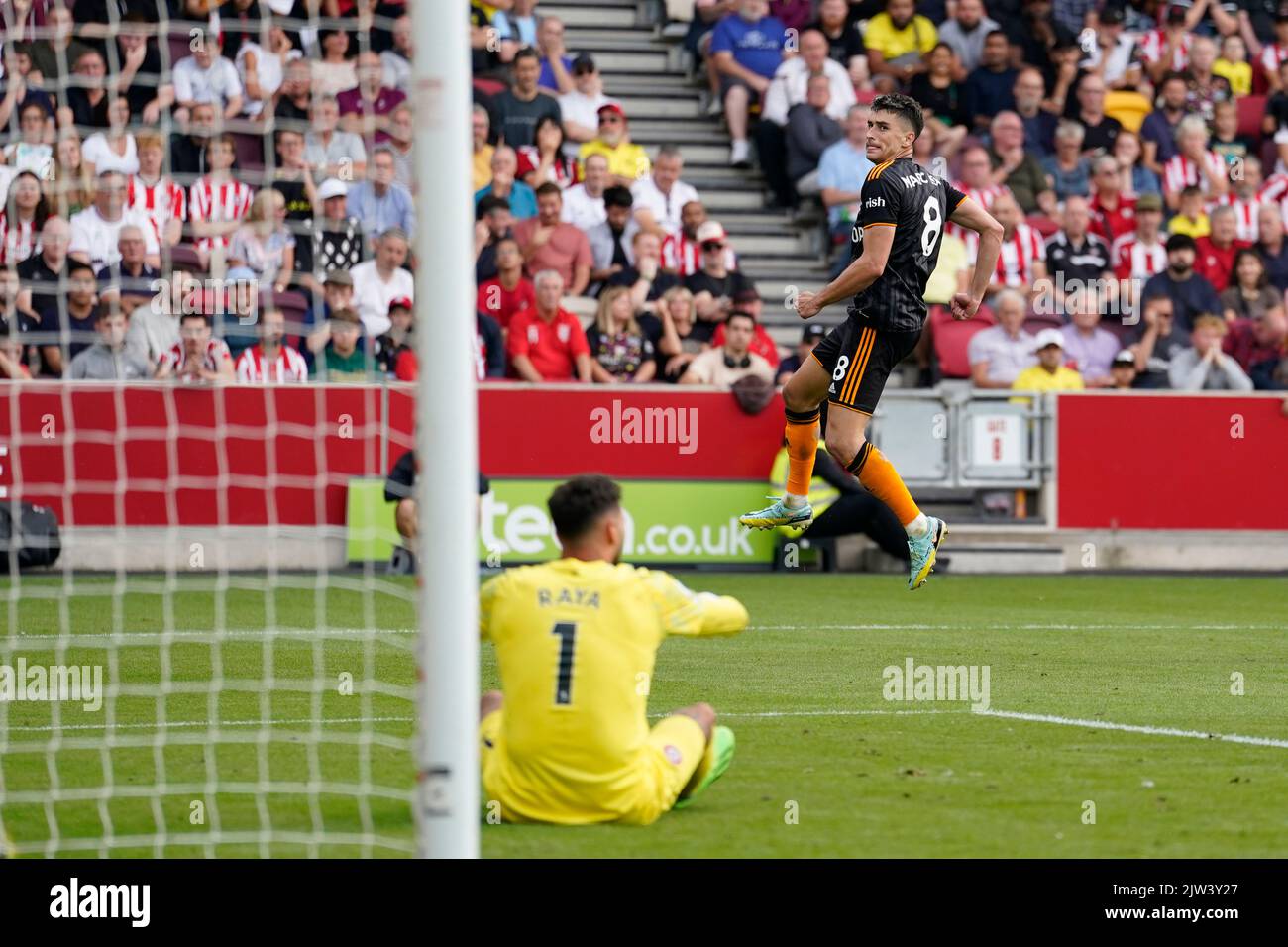 Leeds United's Marc Roca (right) celebrates scoring their side's second ...