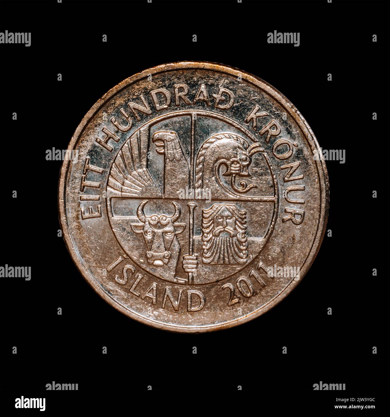 A view of a hundred Icelandic Kronur coin isolated on a black ...