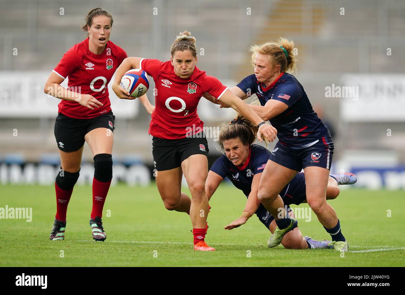 England's Claudia MacDonald gets away from USA's Gabby Cantorna and ...