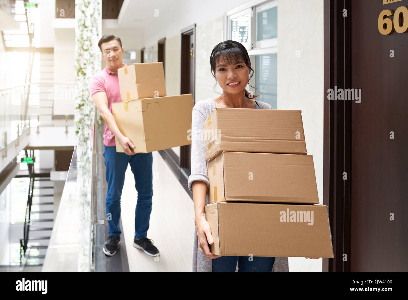 Asian man packing boxes hi-res stock photography and images - Alamy