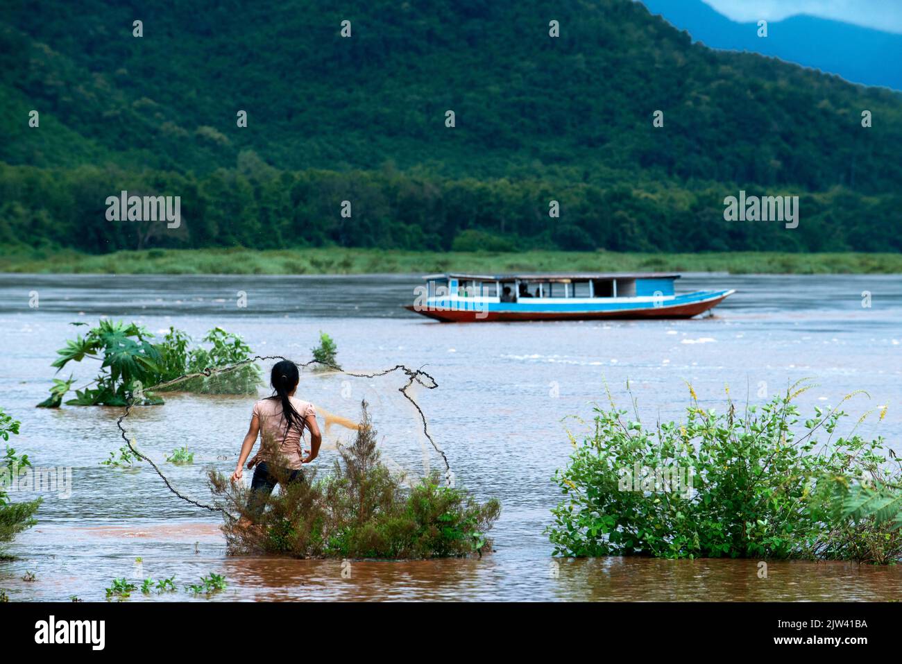 Young people fishing in the Mekong River, Chiang Rai to Luang Prabang ...