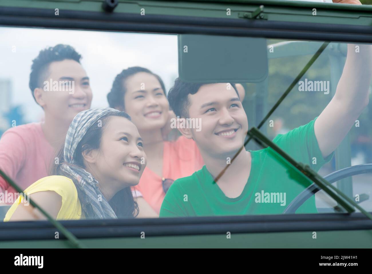 Group of friends making selfie in car on their cellphone Stock Photo ...