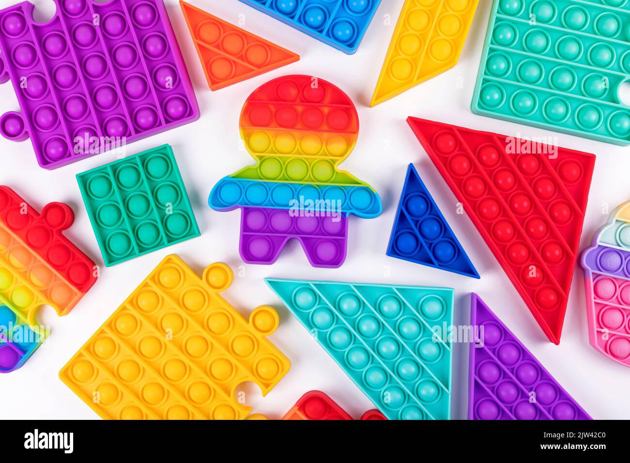 Set of popular colorful fidget toys pop it on blue background. New ...