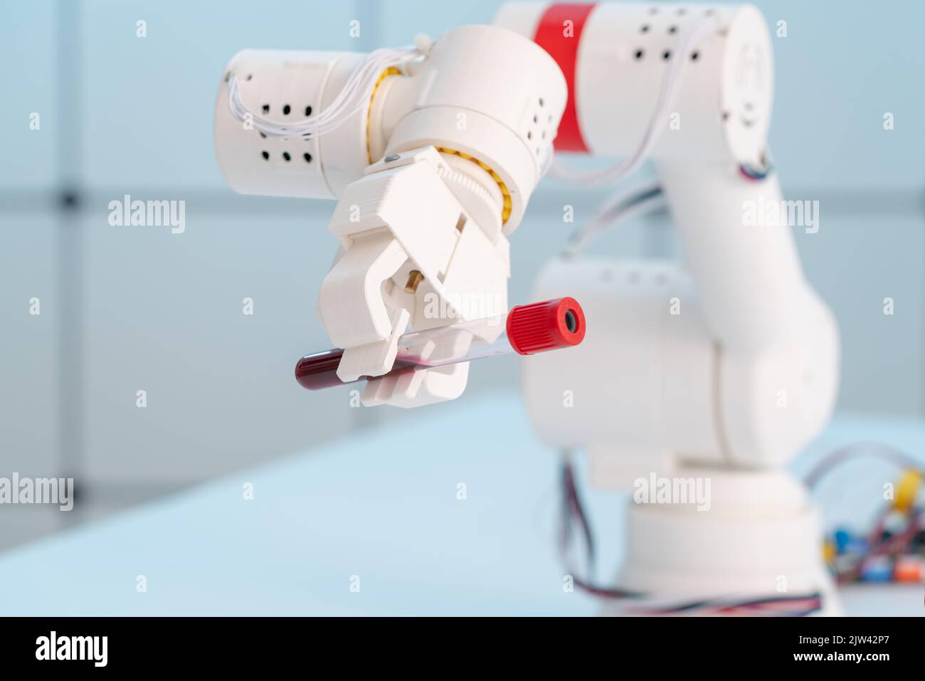 Robot arm with test tube for biological experiments in laboratory Stock ...