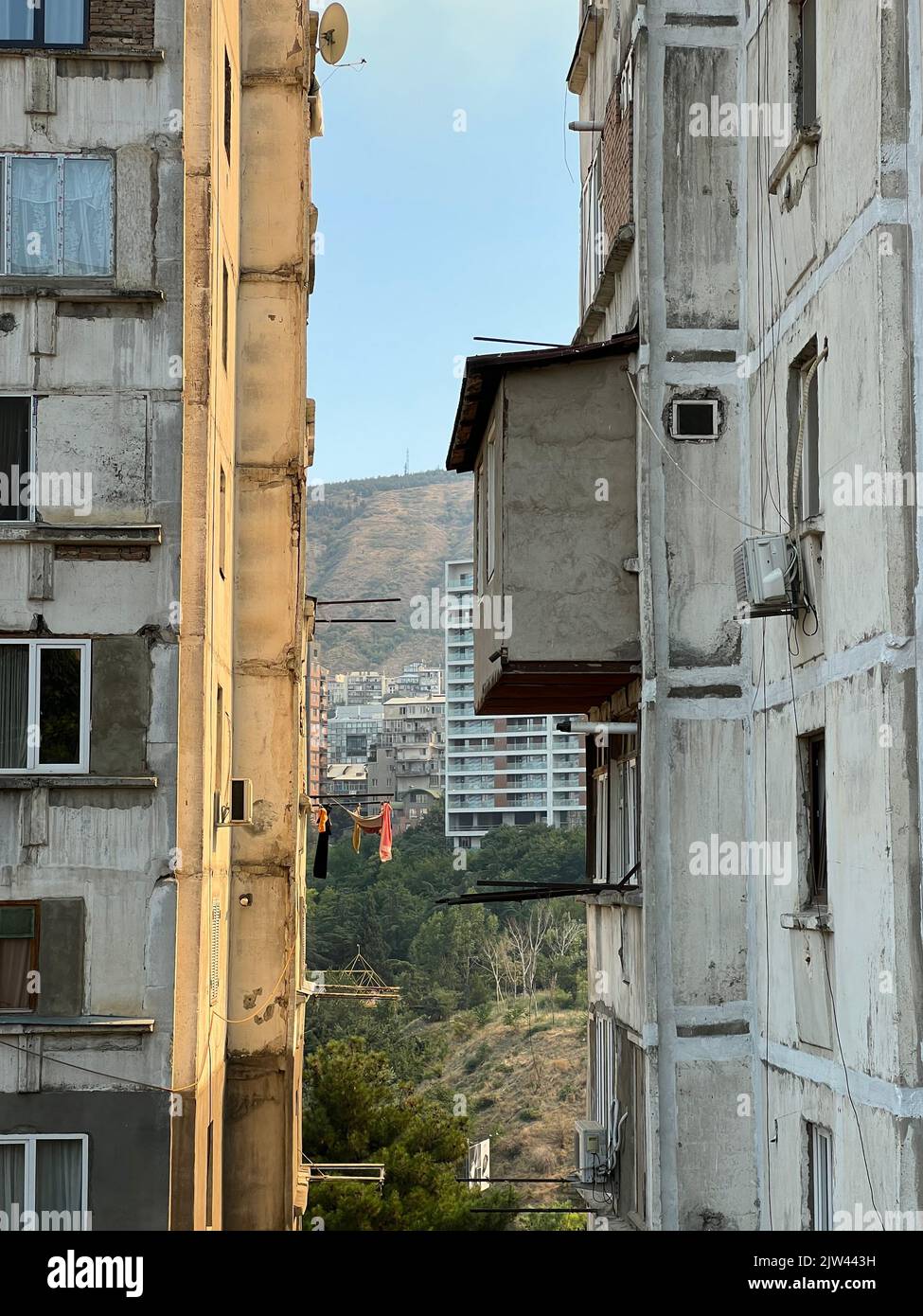 A vertical close up shot of a city through post soviet buildings Stock ...