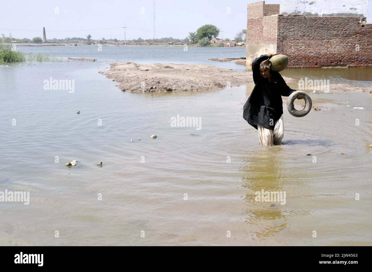 Flood affected people are moving to safe place after submerged into ...