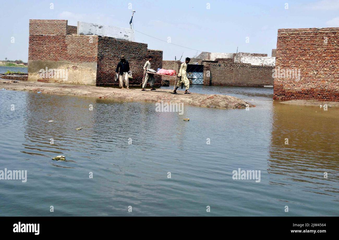 Flood affected people are moving to safe place after submerged into ...