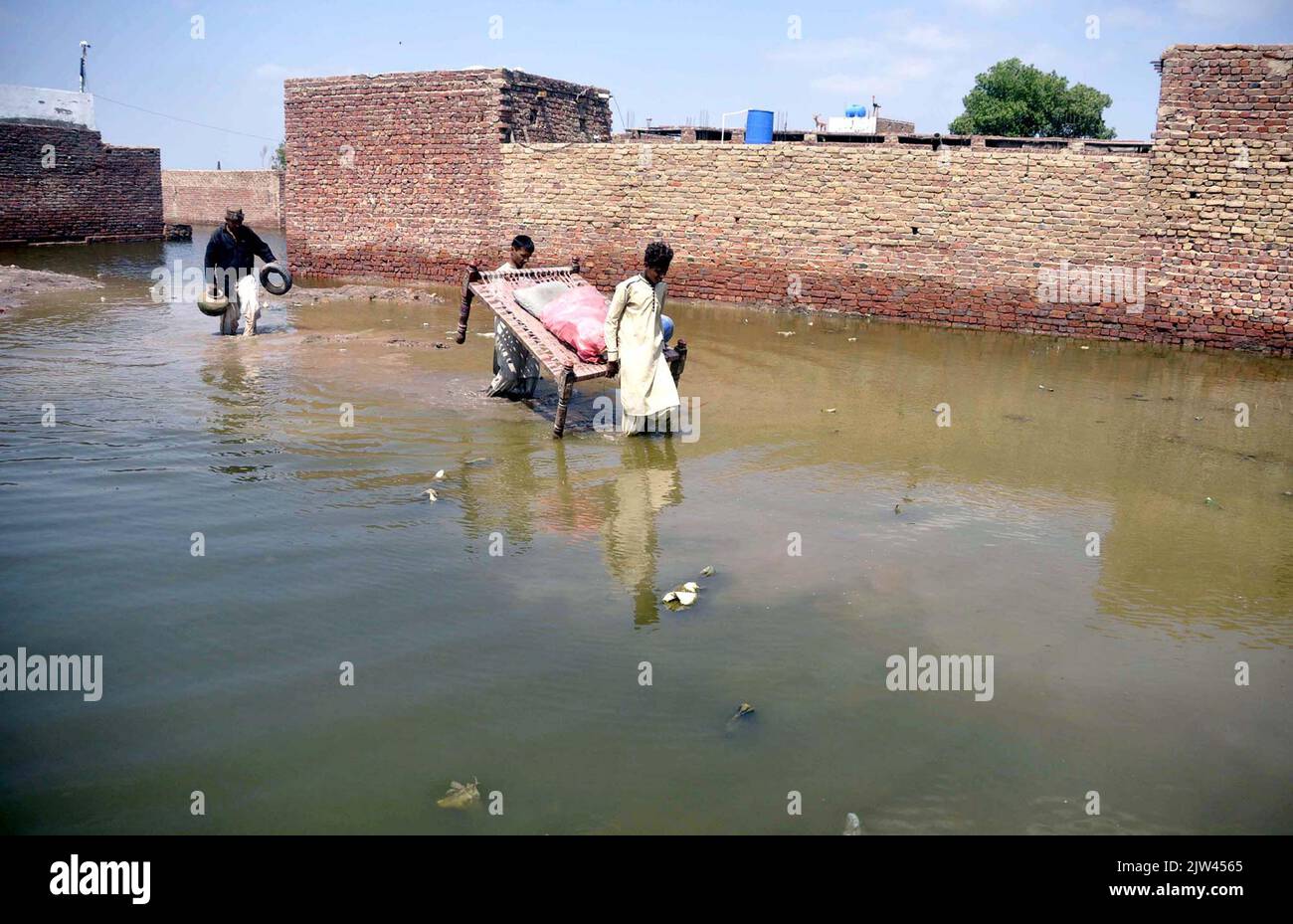 Flood affected people are moving to safe place after submerged into ...