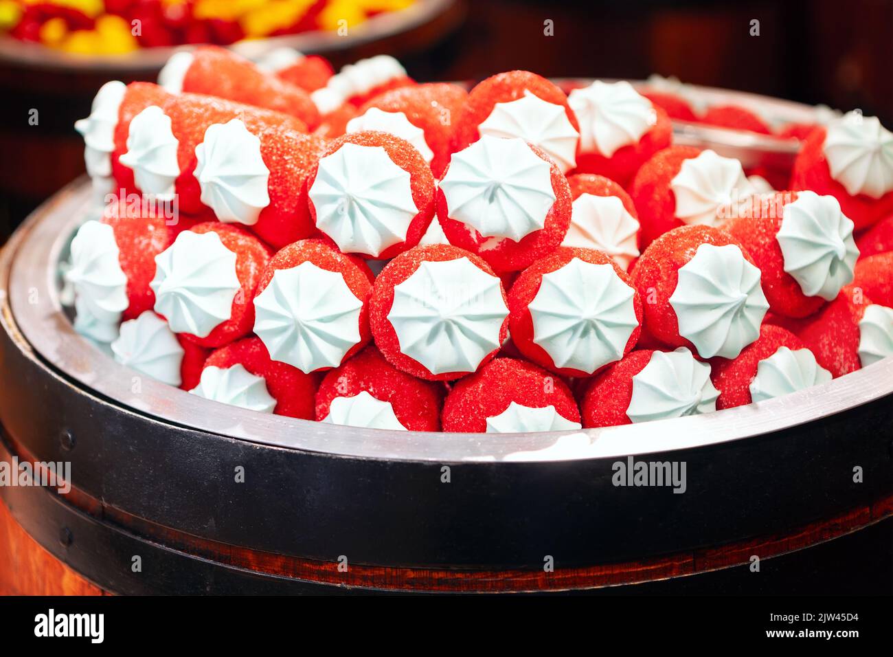 Red cakes with cream . Confectionery display in a shop Stock Photo - Alamy