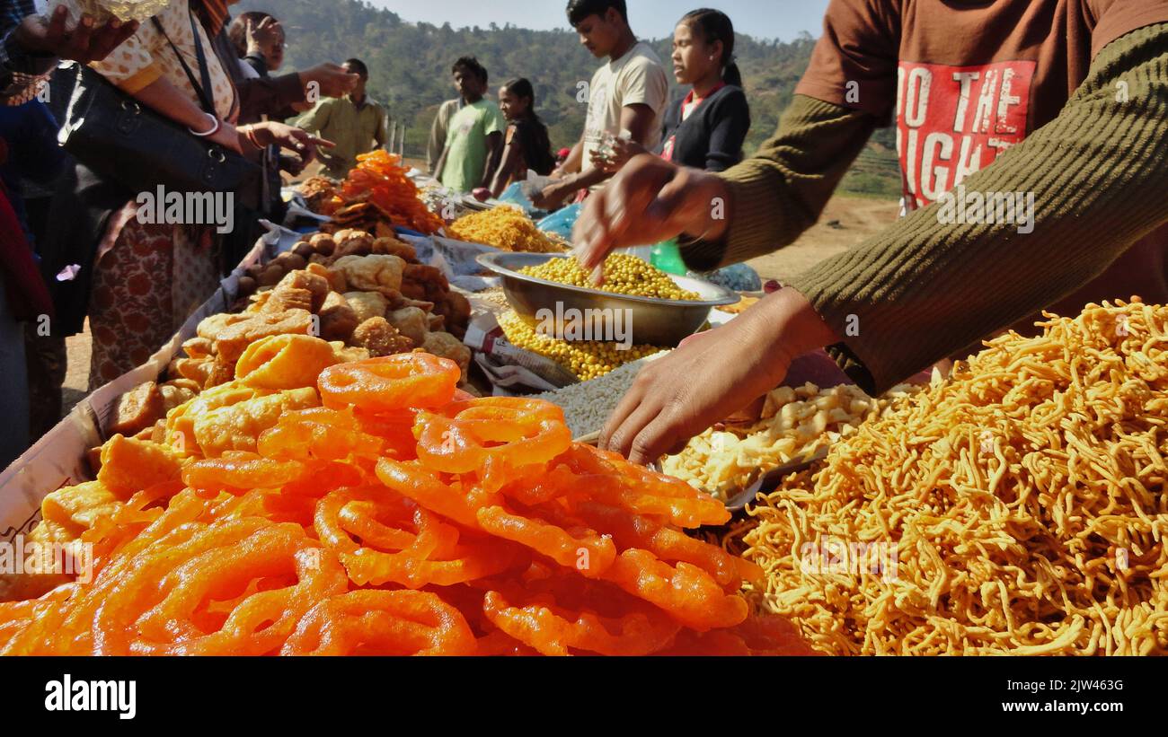 Tourists buying home made food items from local open market called ...