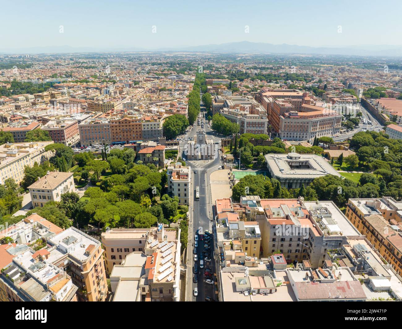 An aerial view of a large square with a roundabout and Arc de Triomphe ...