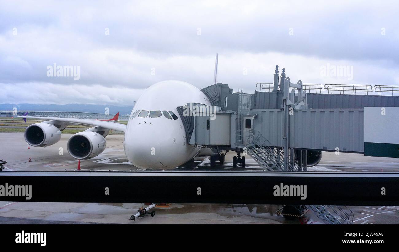 Modern jet bridge connection and airplane and outdoor Stock Photo - Alamy