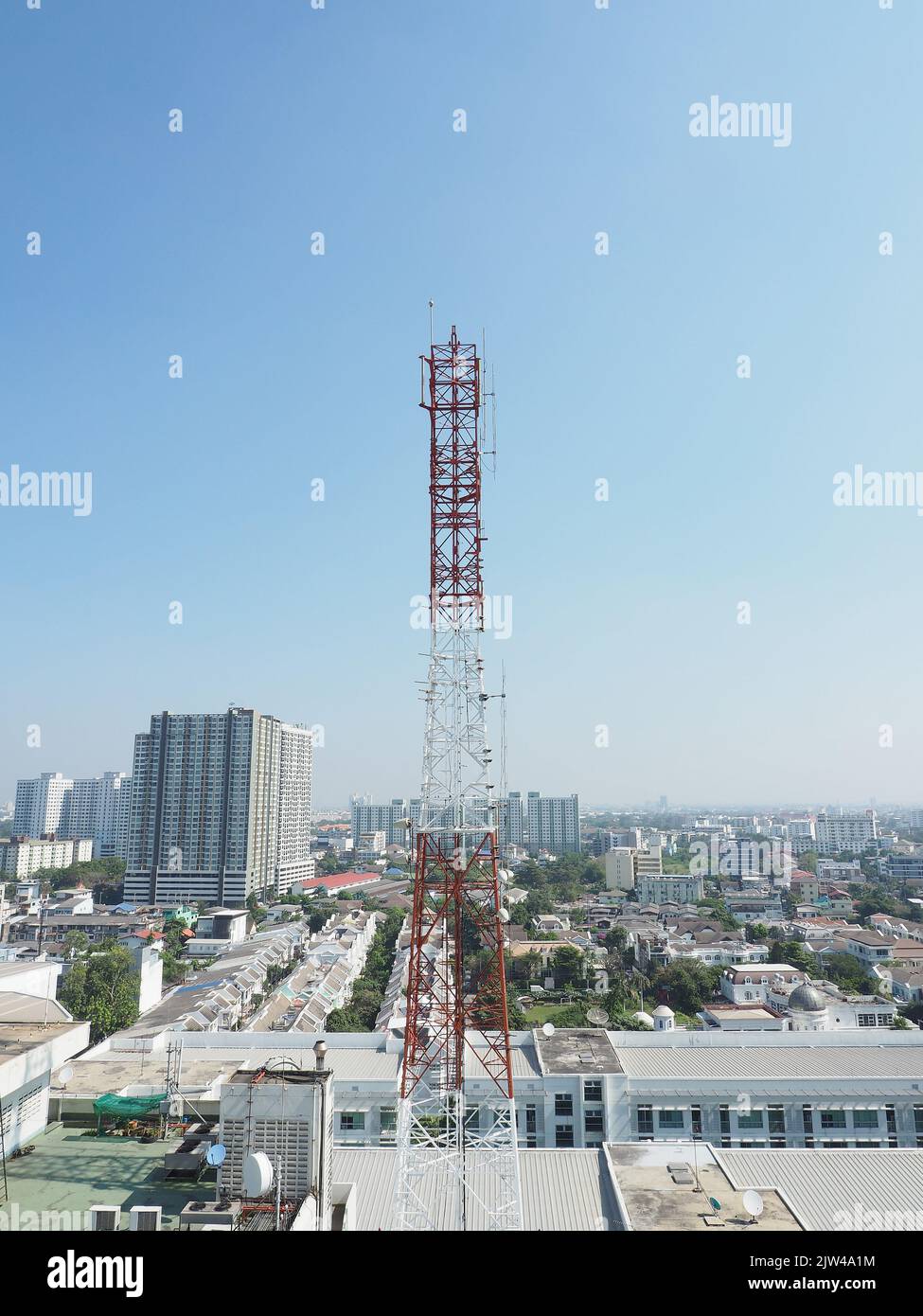 Telecommunication tower red and red color and blue sky Stock Photo - Alamy