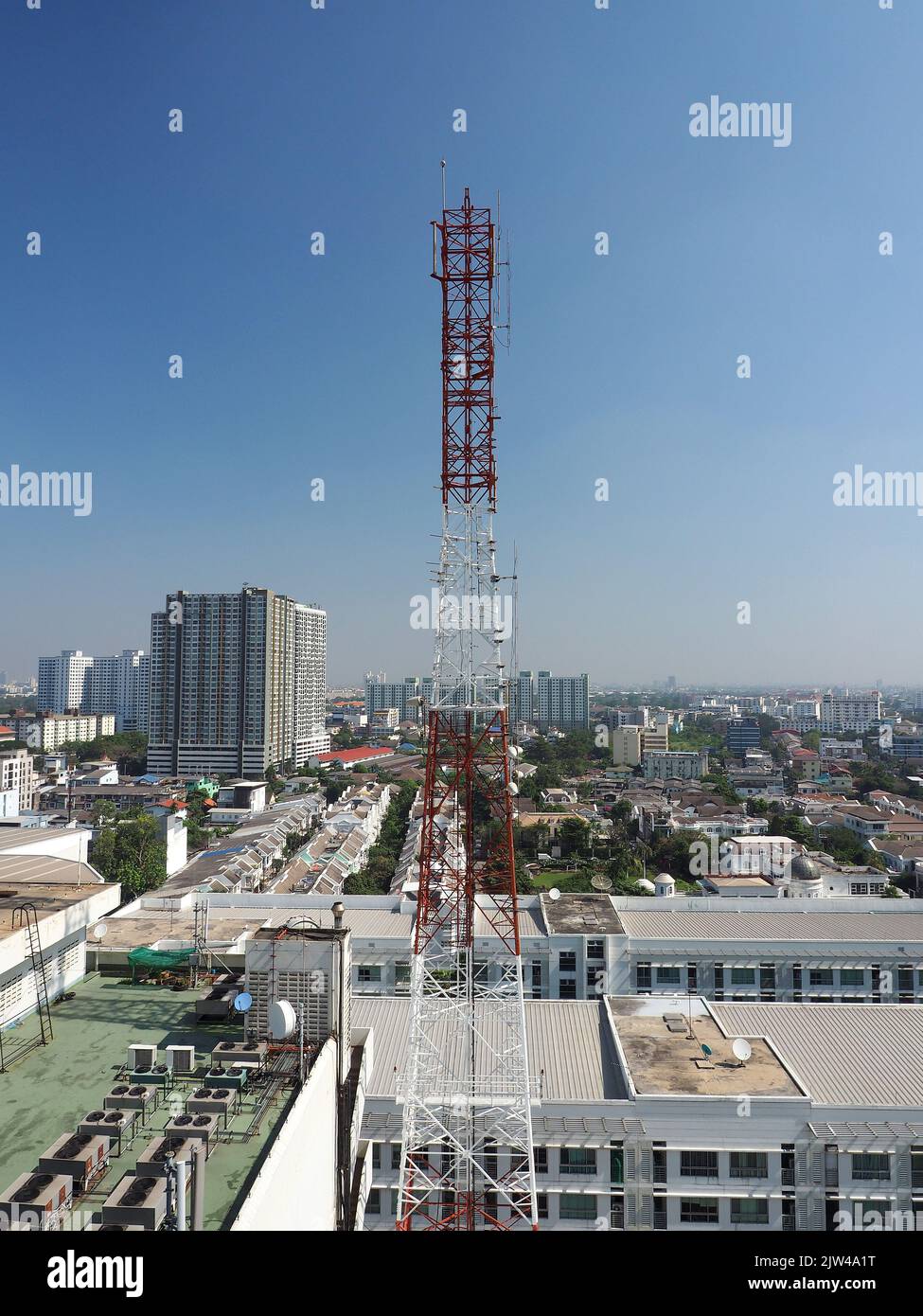 Telecommunication tower red and white color and blue sky Stock Photo ...