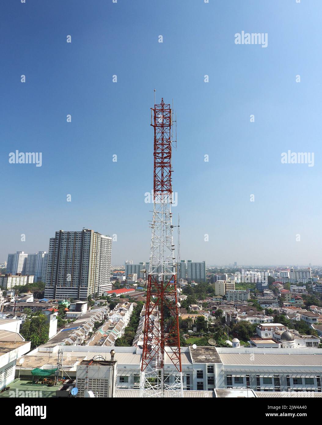 Telecommunication tower red and white color and blue sky Stock Photo ...