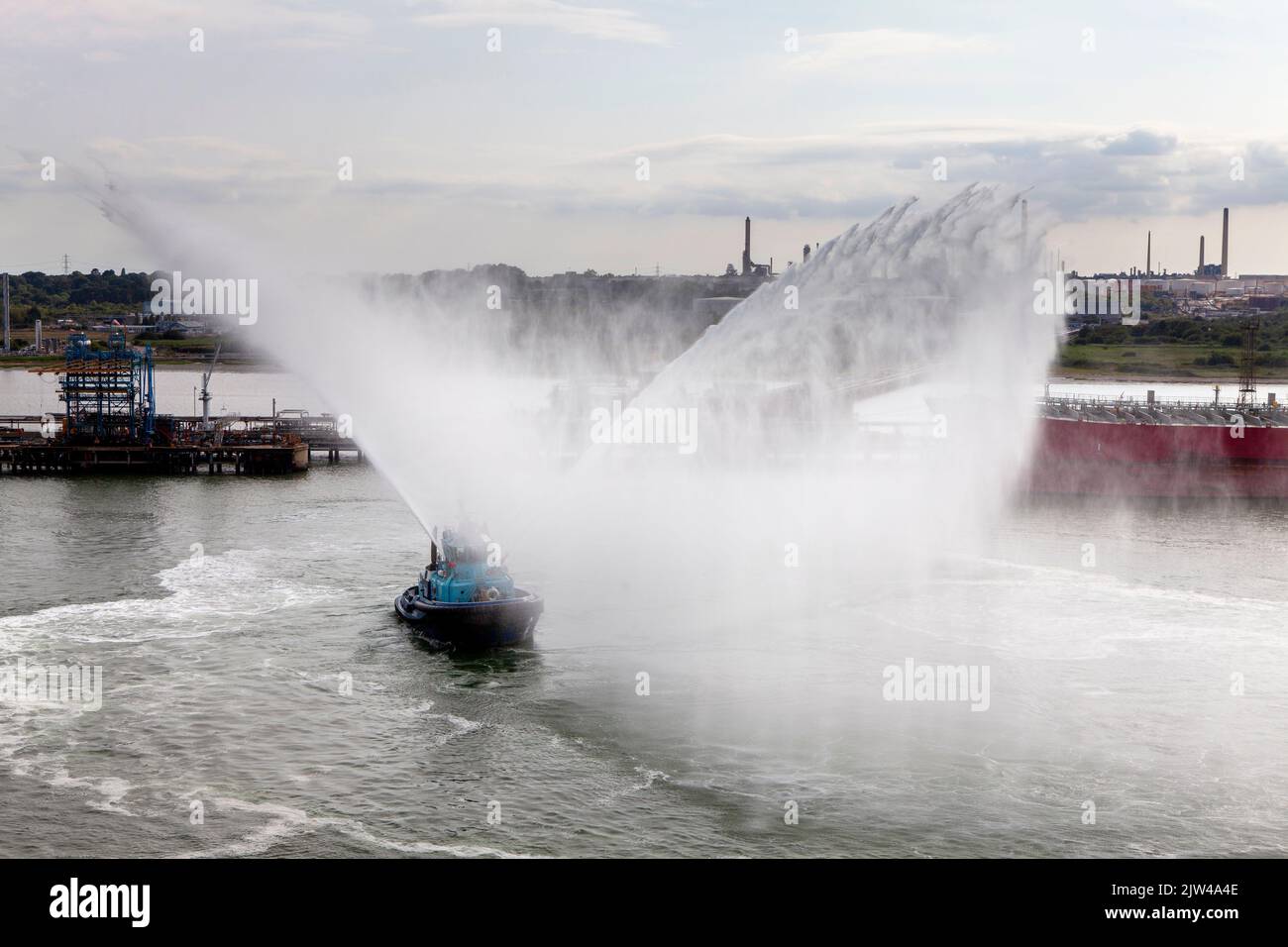 Lomax Fire Fighting Vessel tug water saluting cruise ship Stock Photo ...