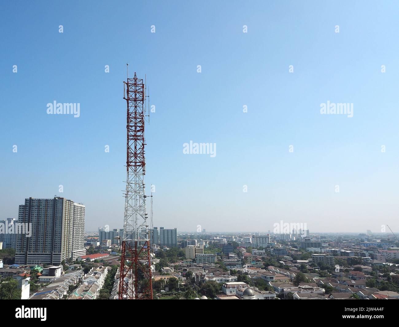 Telecommunication tower red and white color and blue sky Stock Photo - Alamy