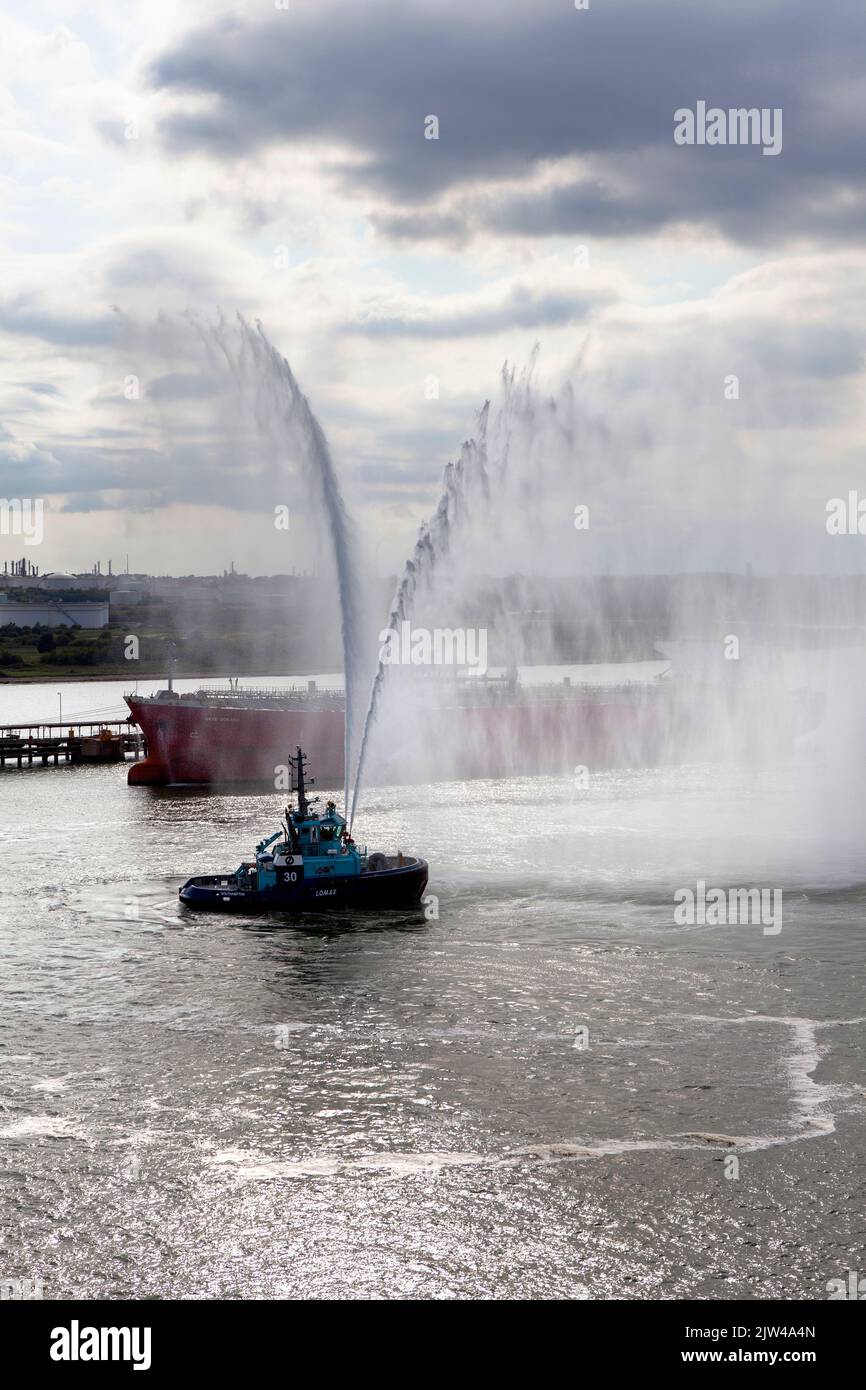 Lomax Fire Fighting Vessel tug water saluting cruise ship Stock Photo ...