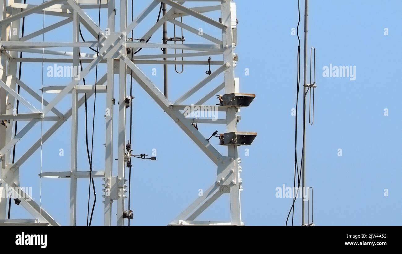 Telecommunication tower closeup and white color and sky Stock Photo - Alamy