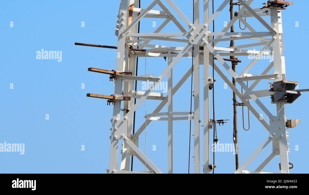 Telecommunication tower closeup and white color and sky Stock Photo - Alamy