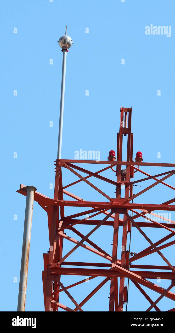 Telecommunication tower closeup and red color and sky Stock Photo - Alamy