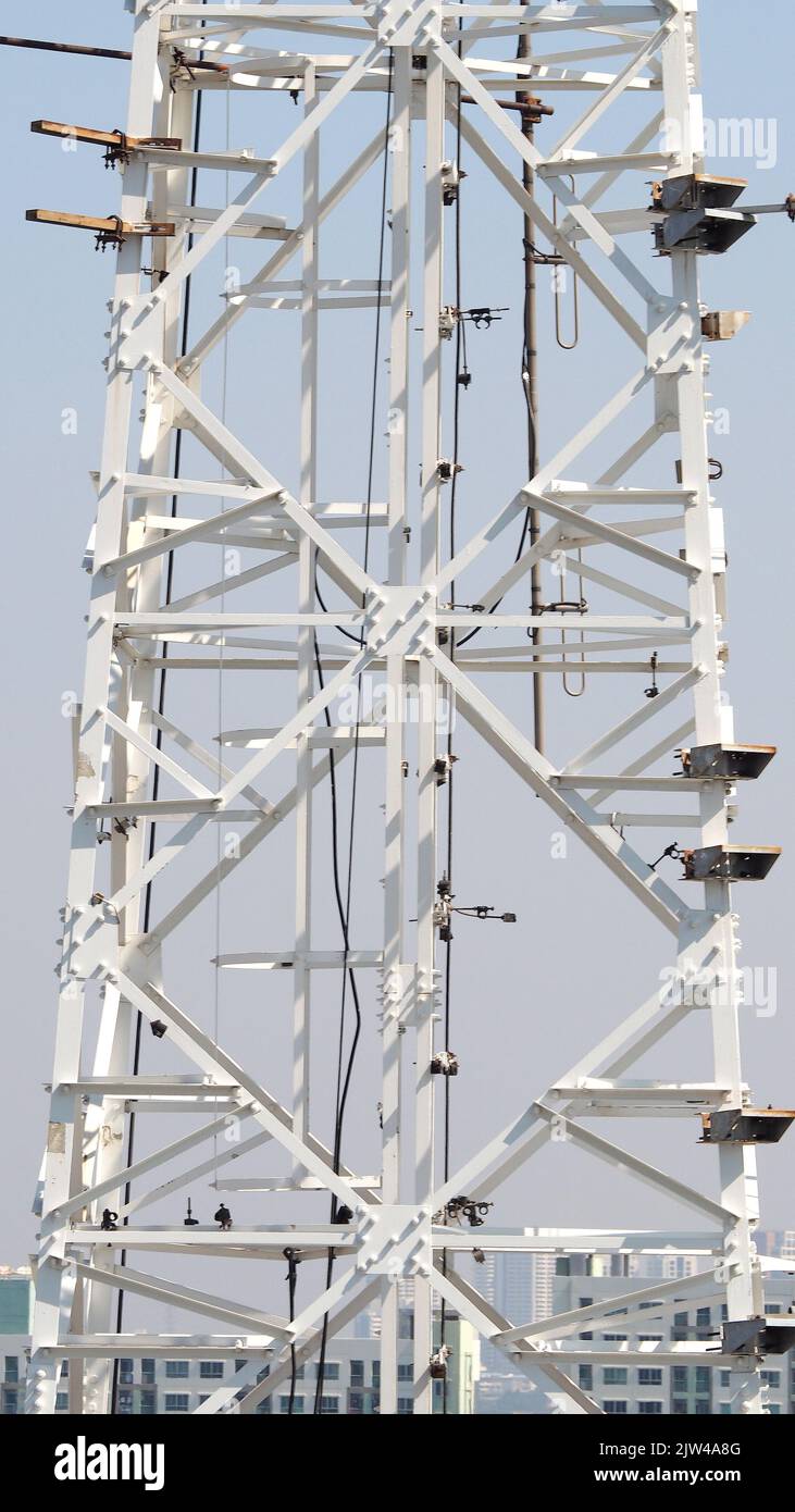 Telecom tower closeup with white color and blue sky Stock Photo - Alamy