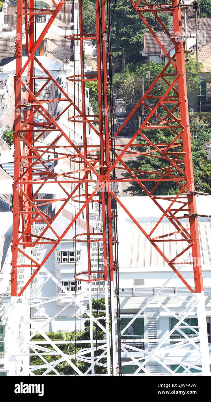 Telecom tower closeup with white and red color and blue sky Stock Photo ...