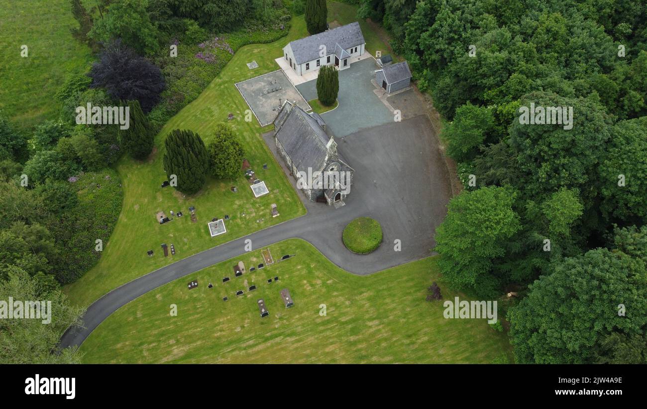 An aerial of the Seskinore chapel of Ease church of Ireland surrounded ...