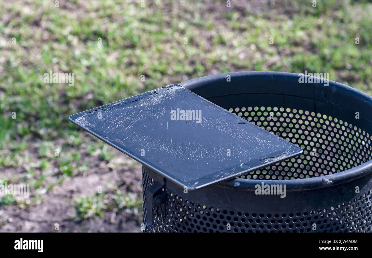 Modern tablet with highly broken screen lies on the trash Stock Photo ...