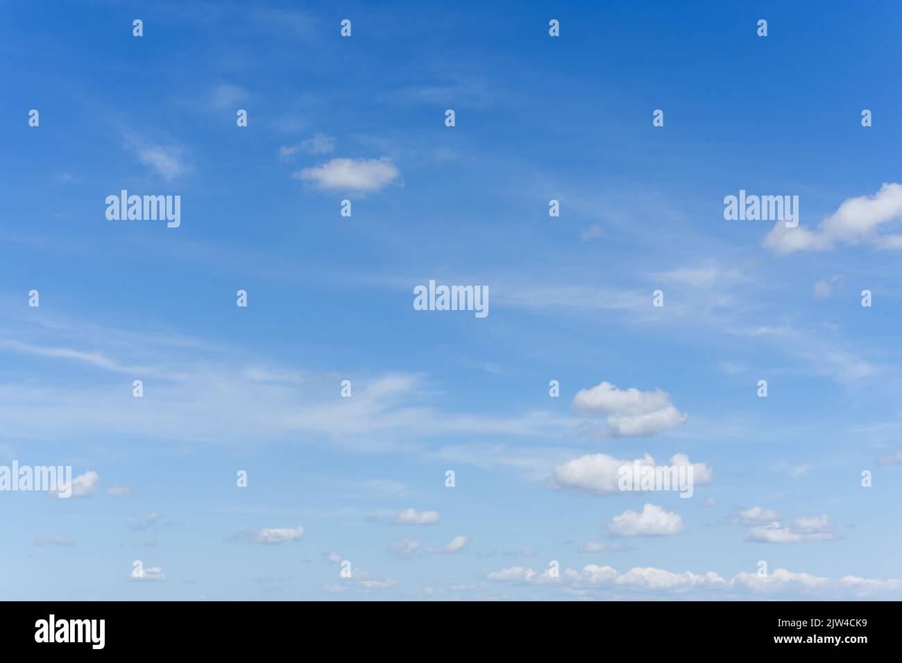 Daytime summer blue saturated sky with blurry clouds. Feeling of ...