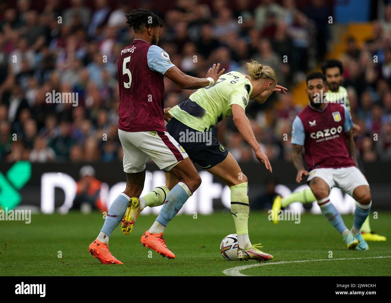 Manchester City's Erling Haaland (right) draws the fould from Aston ...