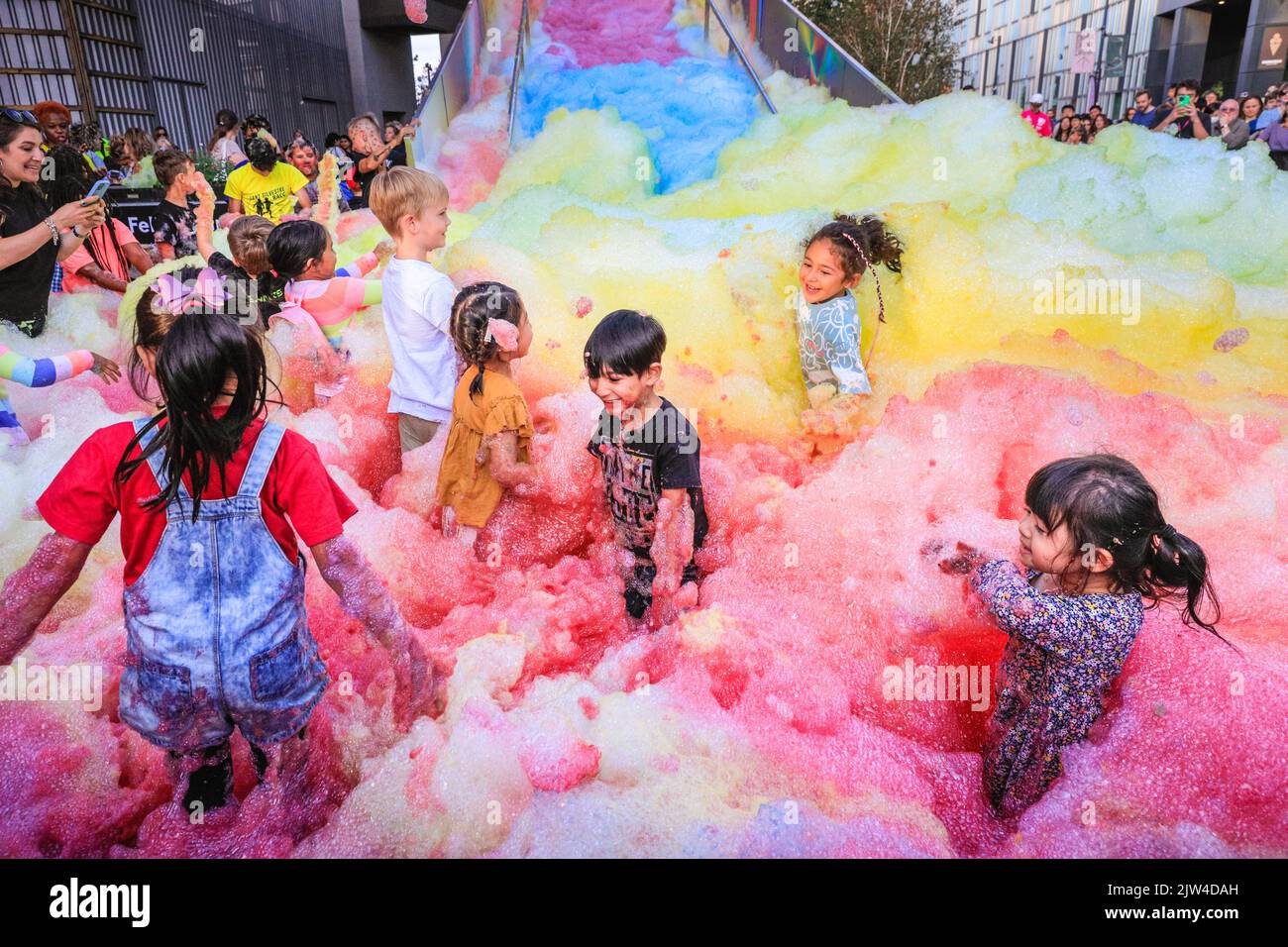 London, UK. 03rd Aug, 2022. Children have fun in the foam. People ...