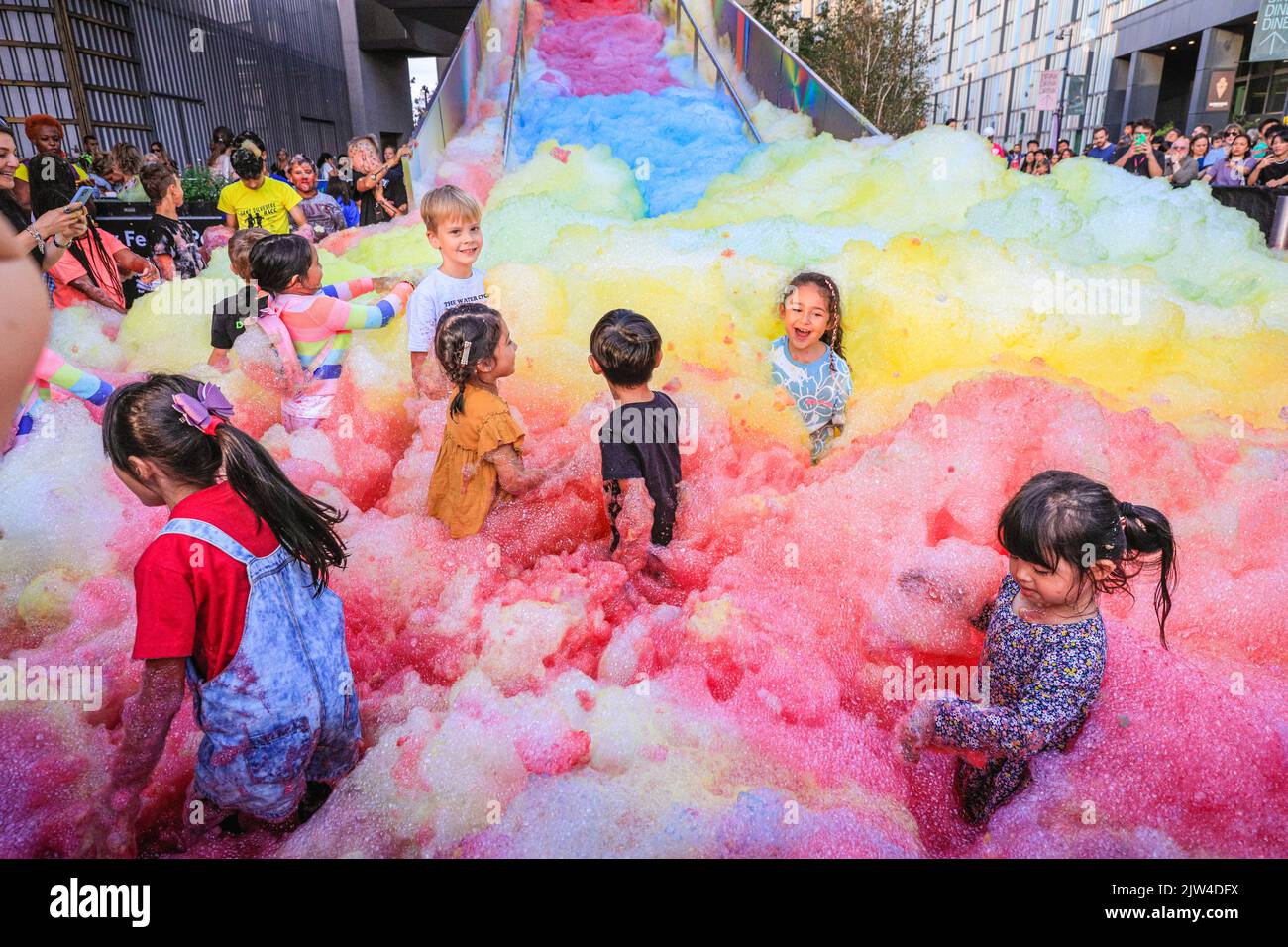 London, UK. 03rd Aug, 2022. Children have fun in the foam. People ...