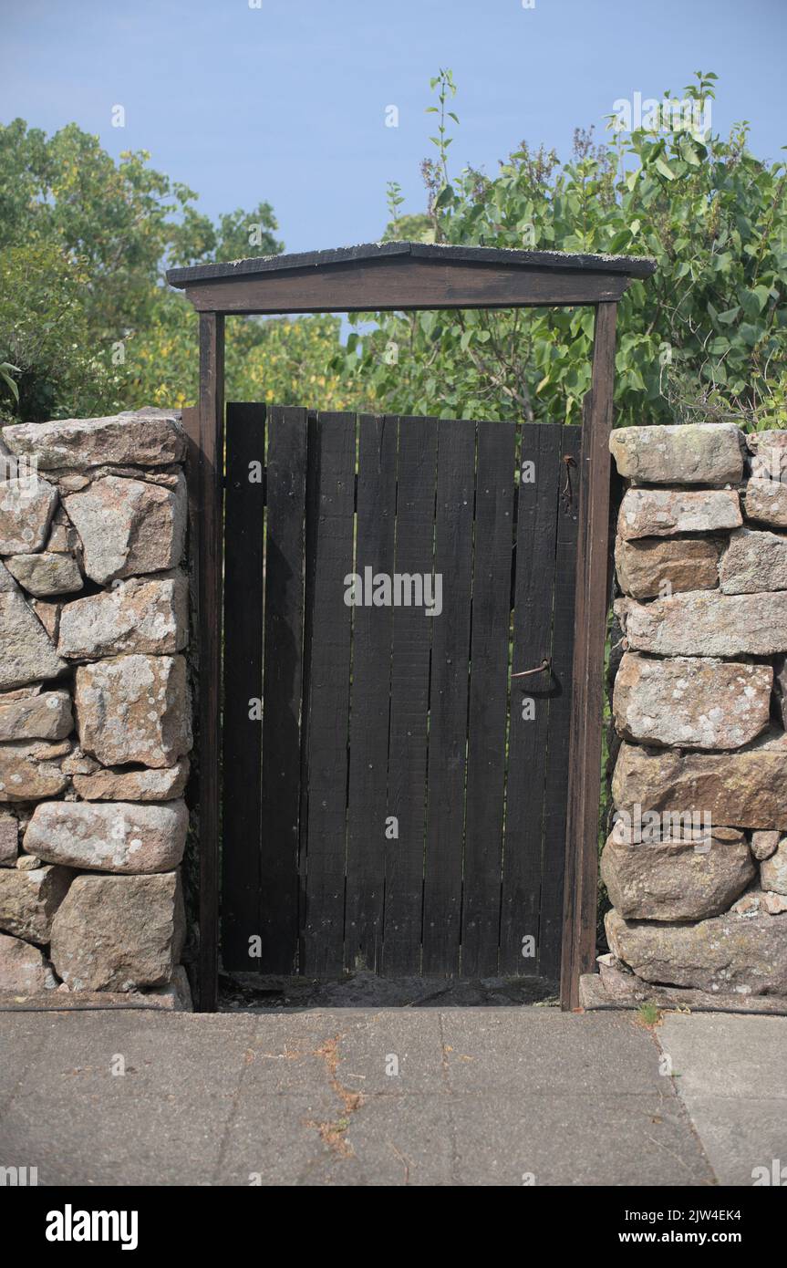 Wooden Gate in stone wall, Christiansø archipelago, Denmark Stock Photo ...