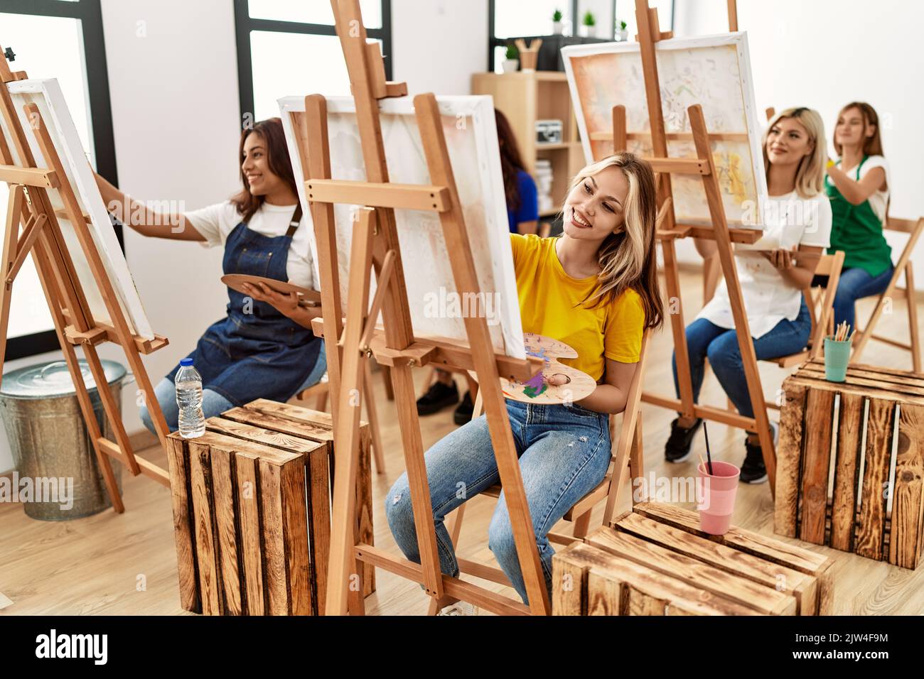 Group of young artist girls smiling happy drawing at art studio Stock ...