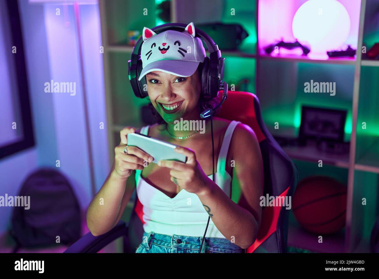 Young beautiful hispanic woman streamer playing video game by ...