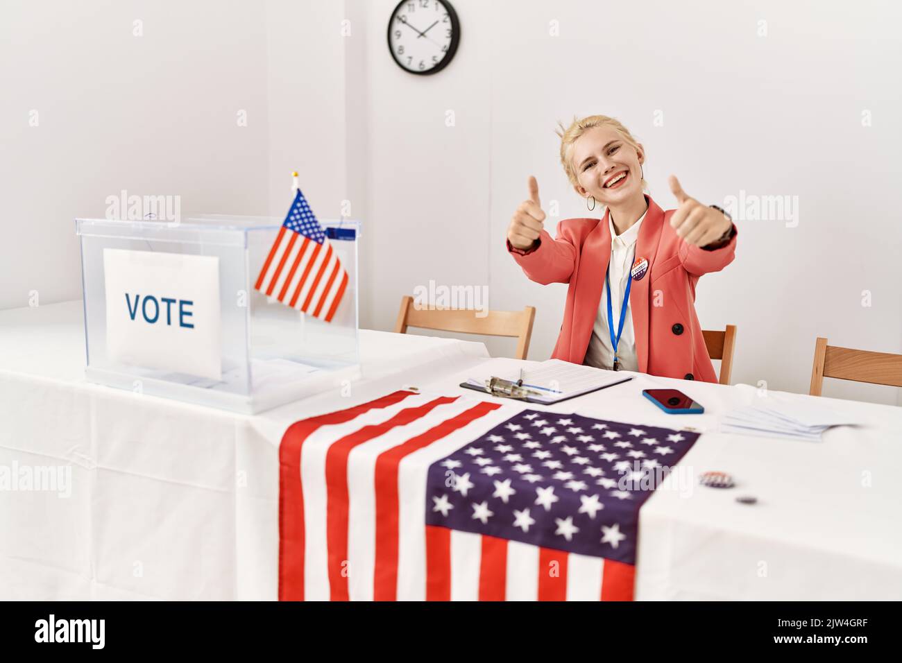 Beautiful caucasian woman working at political campaign approving doing ...
