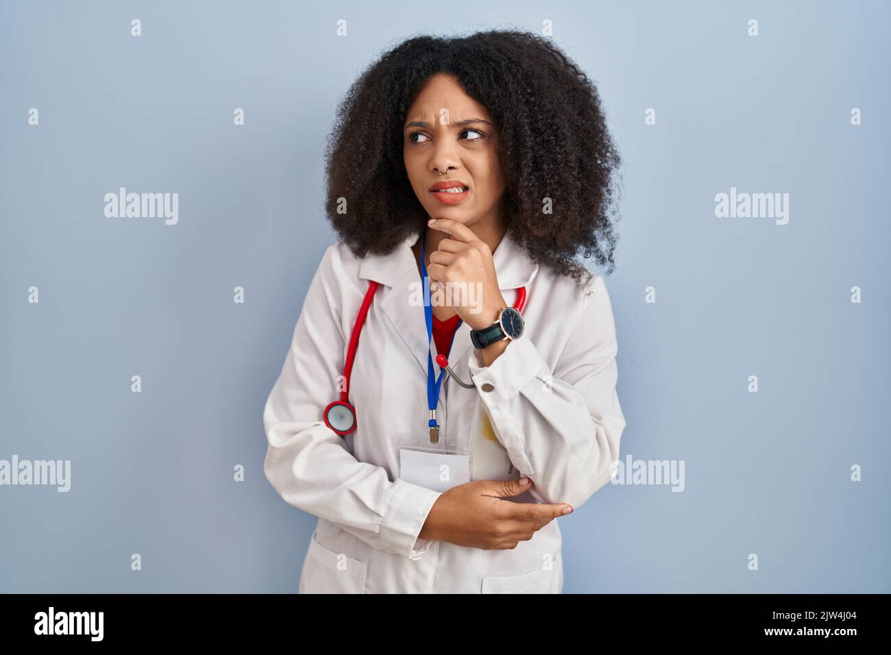 Young african american woman wearing doctor uniform and stethoscope ...