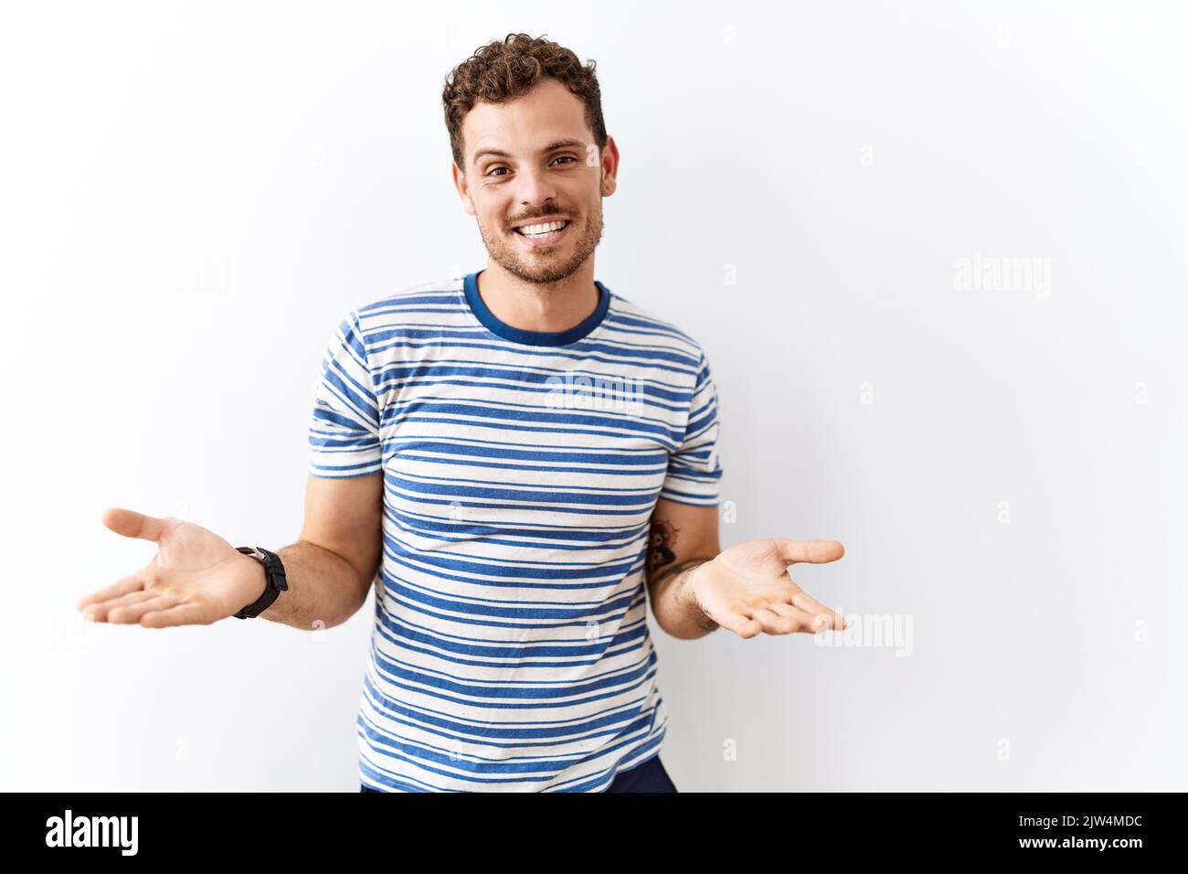 Handsome young man standing over isolated background smiling cheerful ...