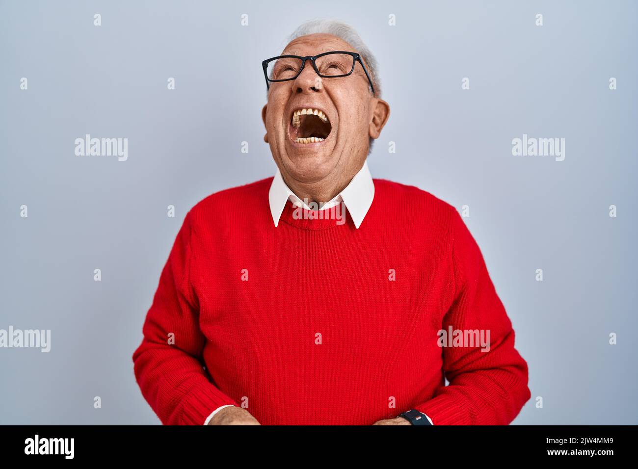 Senior man with grey hair standing over isolated background angry and ...