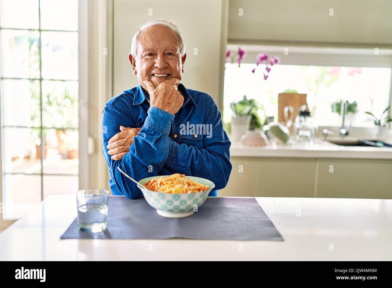 Old man eating pasta smile hi-res stock photography and images - Alamy