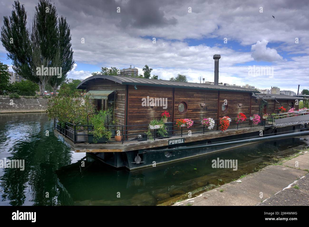 Paris, France - May 29, 2022: Pretty houseboat with colorful flowers ...