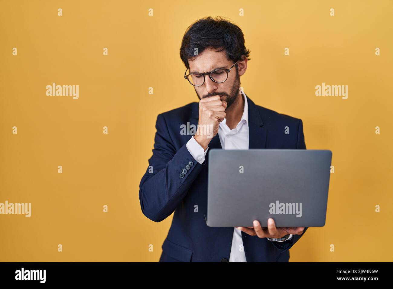 Handsome latin man working using computer laptop feeling unwell and ...